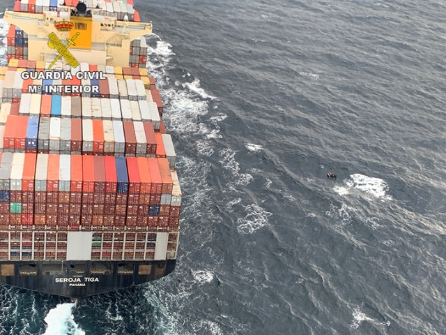 Container ship and immigrants boat 2 - Container News