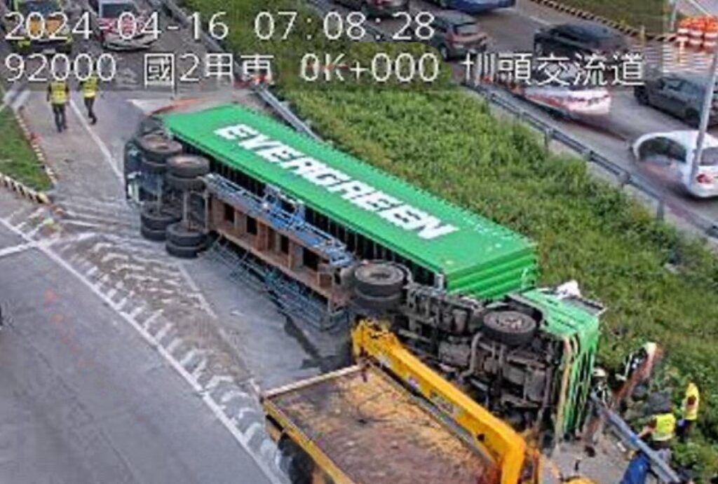 Truck carrying Evergreen container flips on side, blocks freeway ...